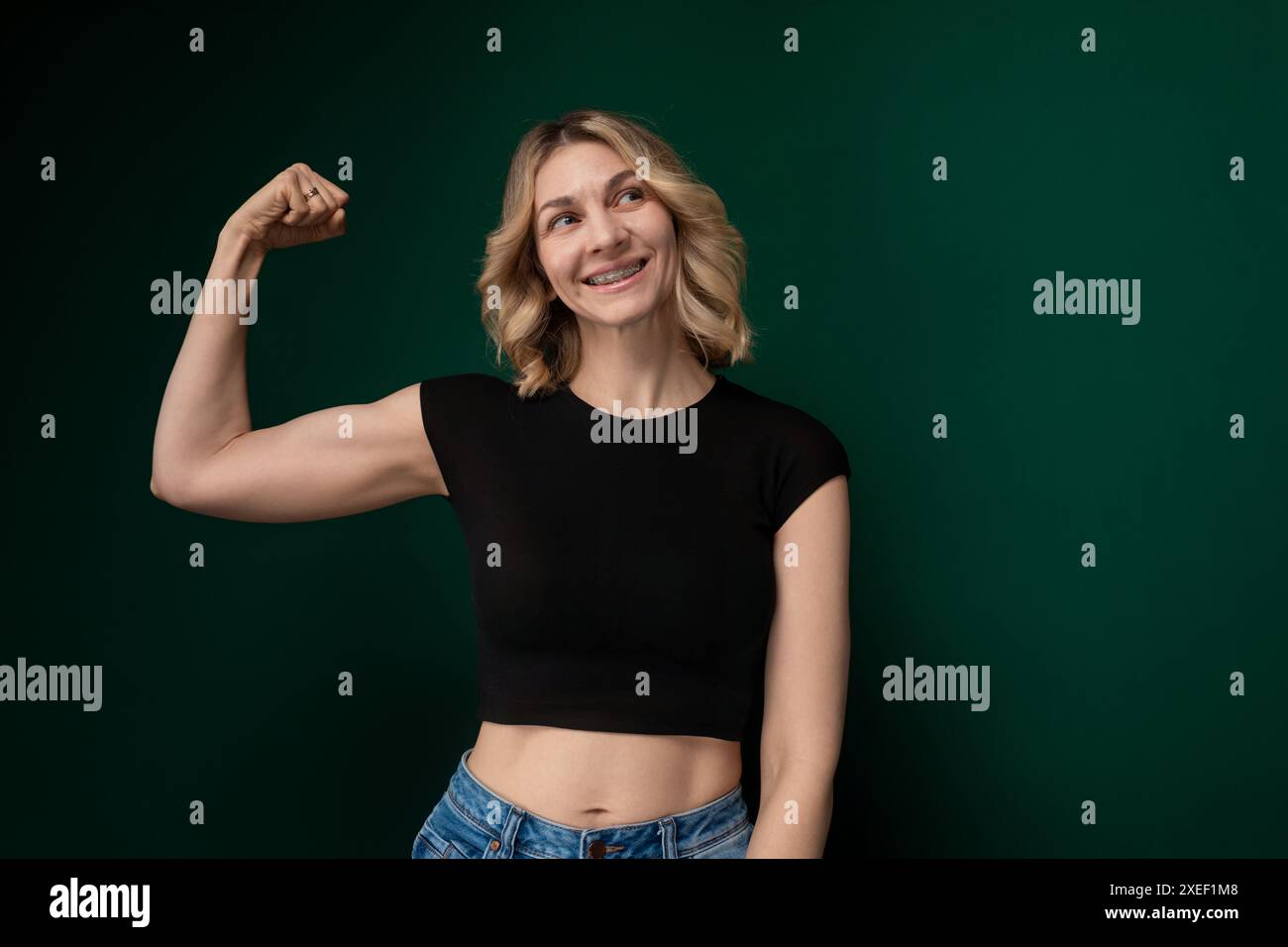 Young woman posing arm hi-res stock photography and images - Alamy