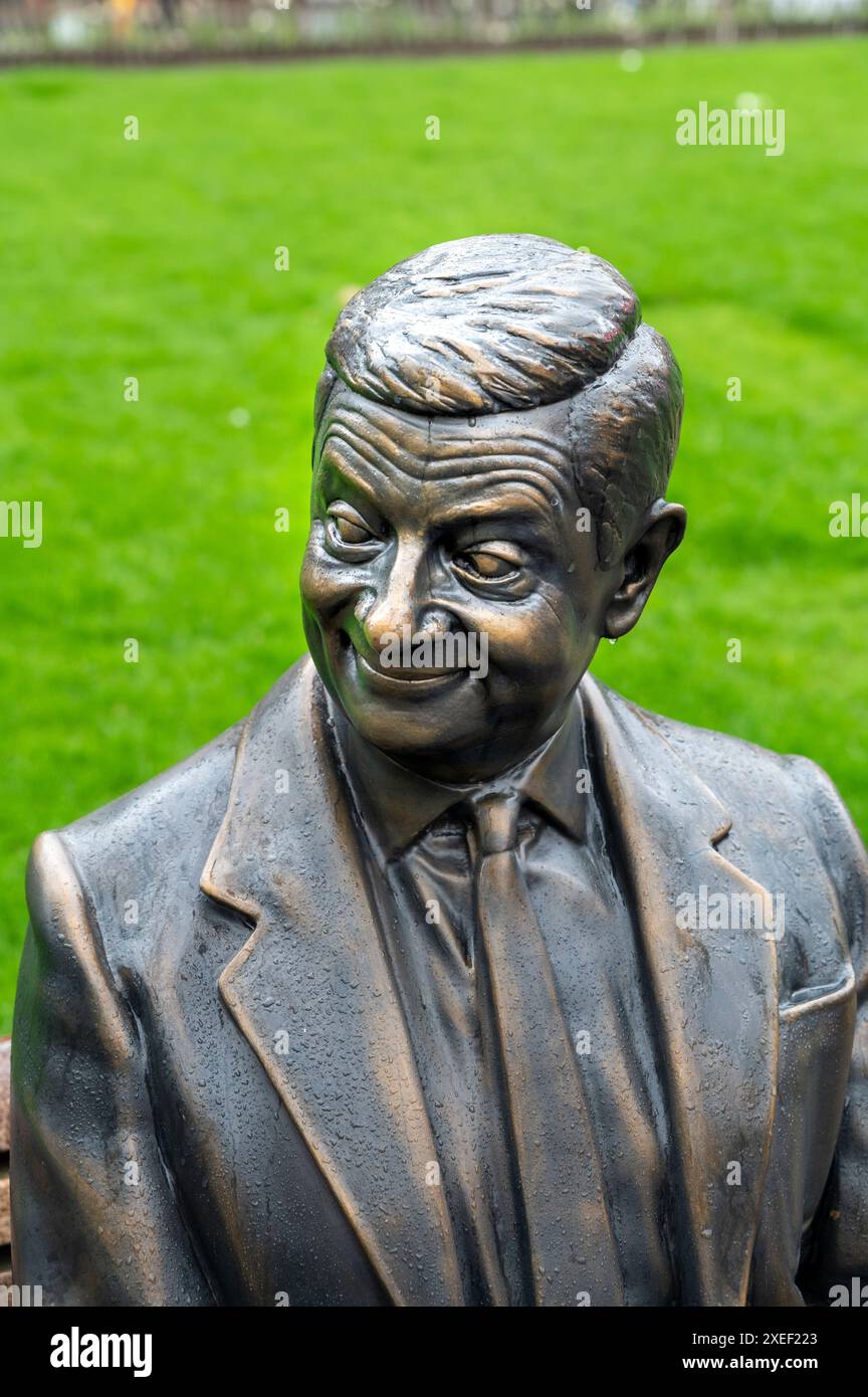 London, UK - March 22, 2024 : Statue of Mr Bean sitting on a bench ...