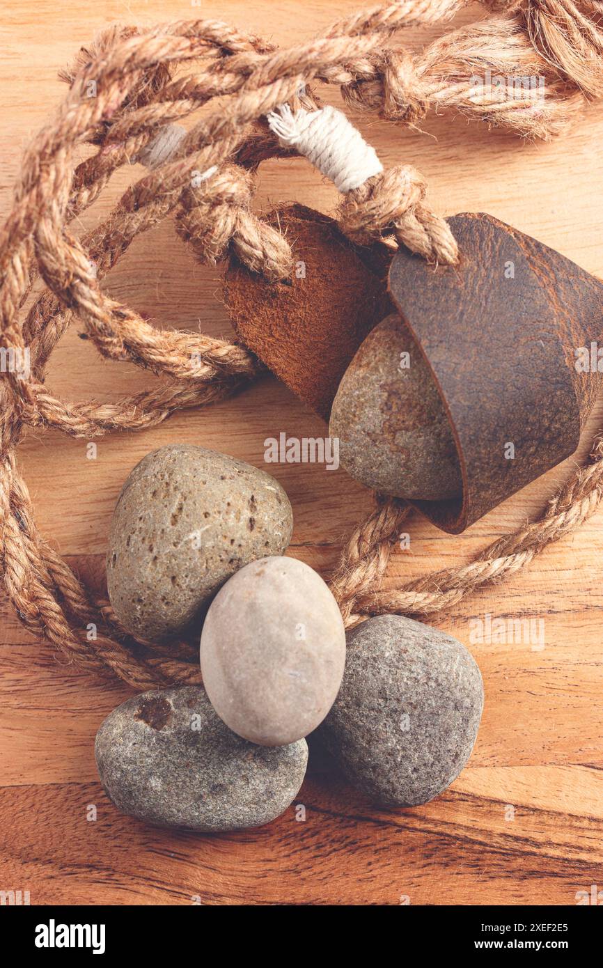 Sling Shot and Stones on a Wooden Table from the Story of David and ...