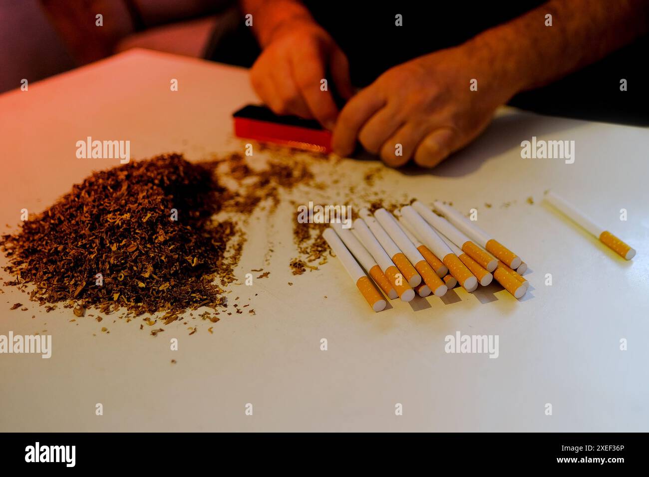 Manual cigarette making hand made hi-res stock photography and images ...