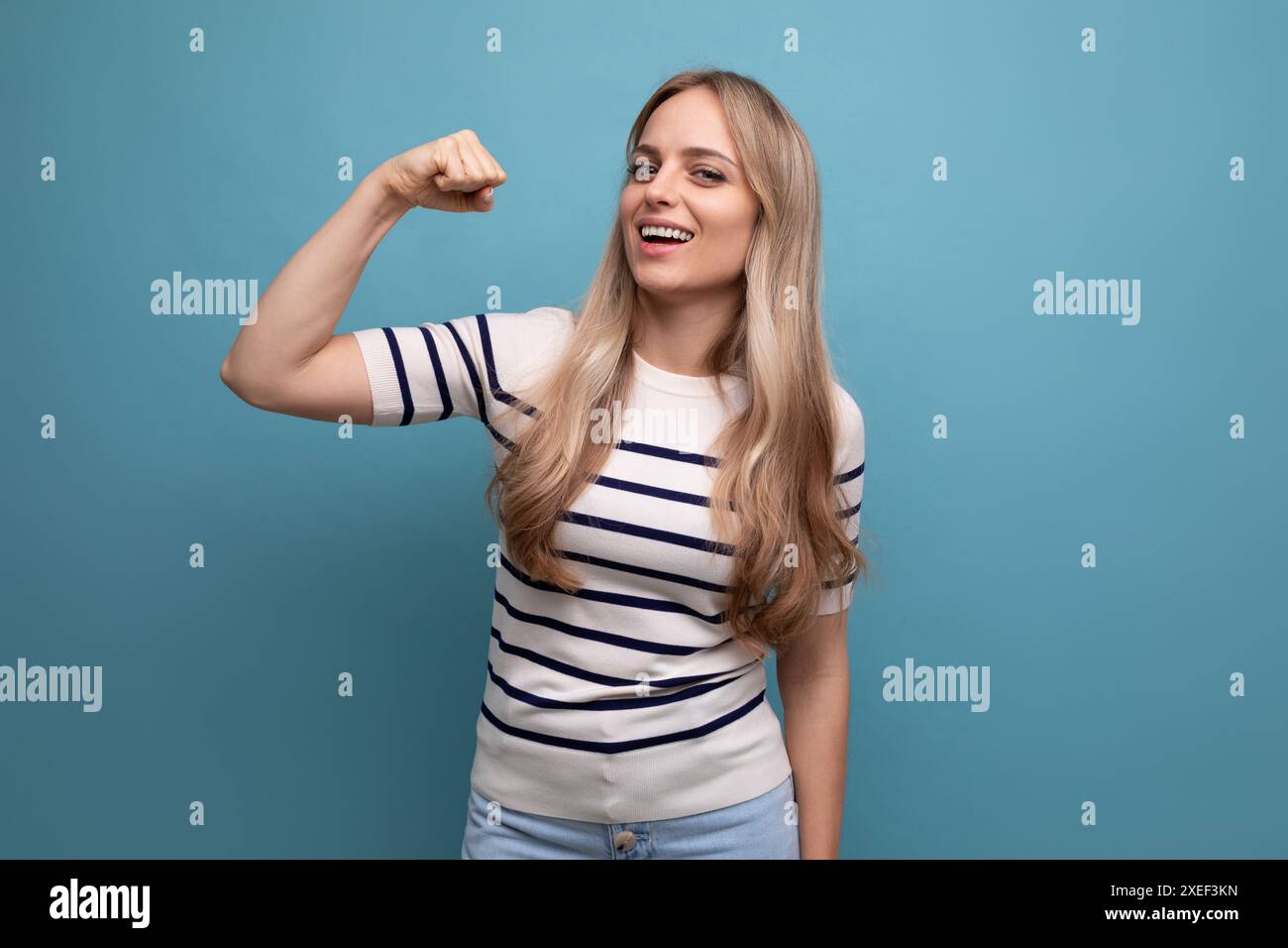 close-up photo of a strong girl in casual clothes showing superiority ...