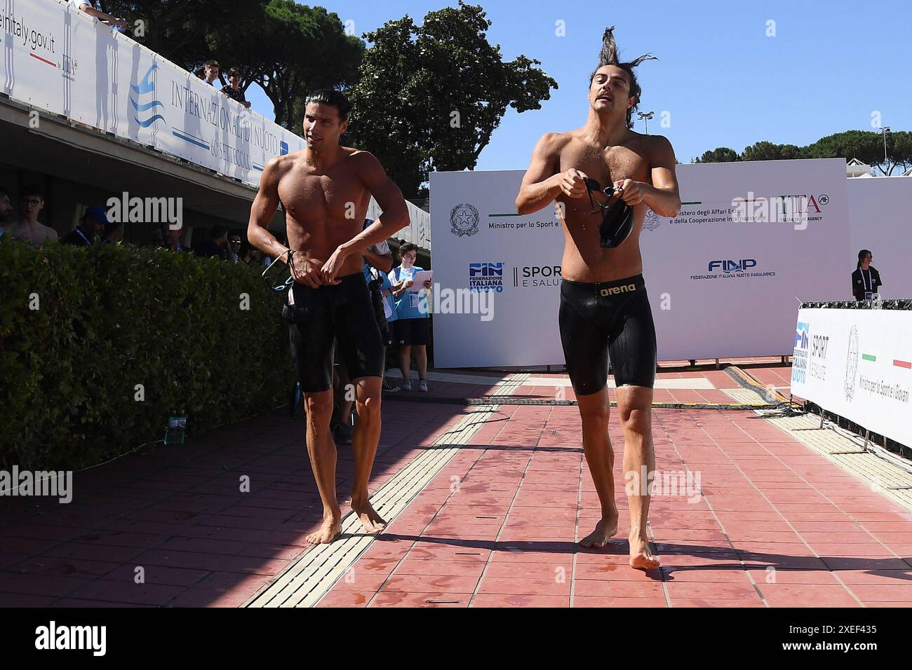 Lorenzo Mora and Thomas Ceccon of Italy react after competing in the ...