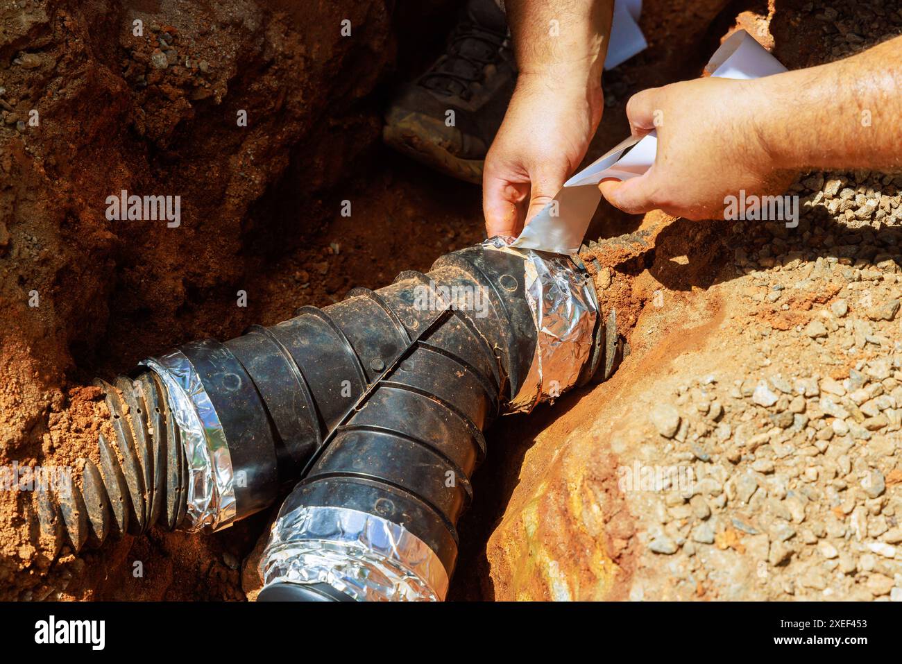 At trench installation of drainage pipe for draining rainwater Stock ...