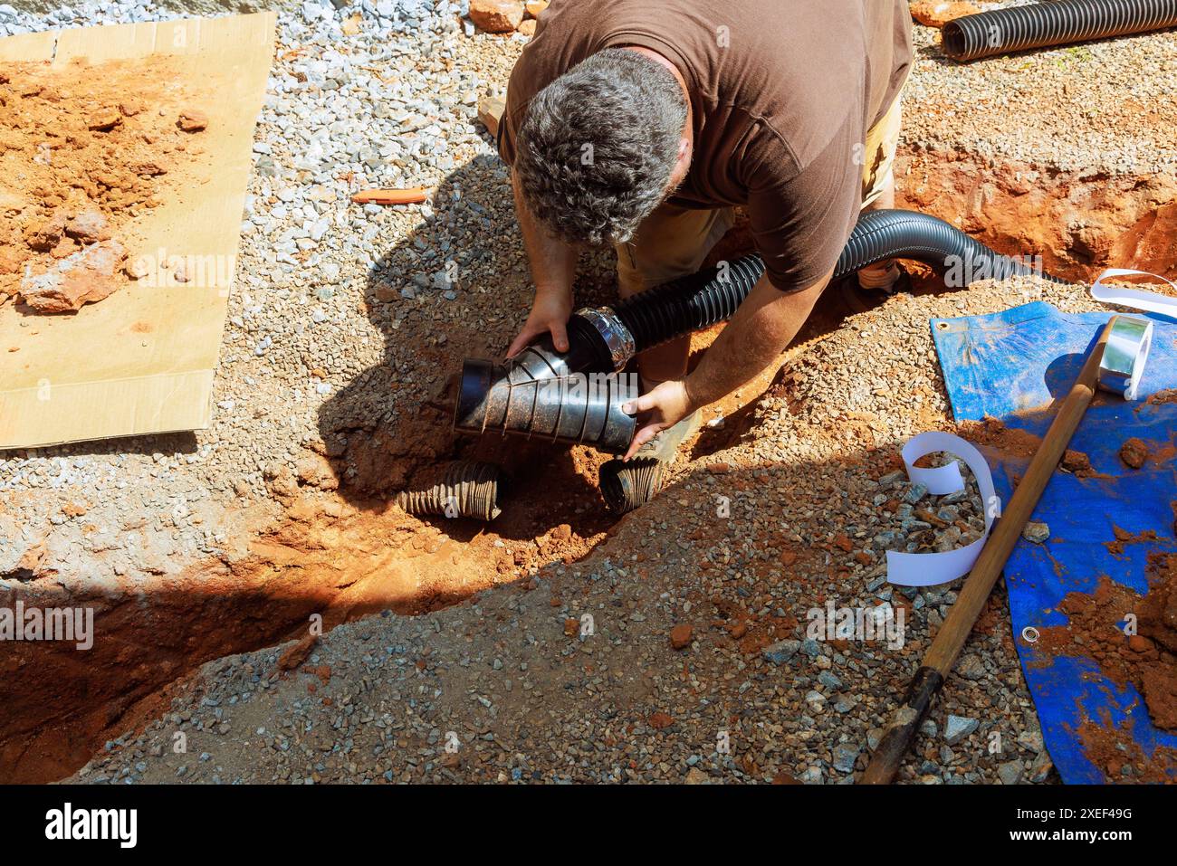 Trench is being prepared for assembly of drainage perforated flexible ...