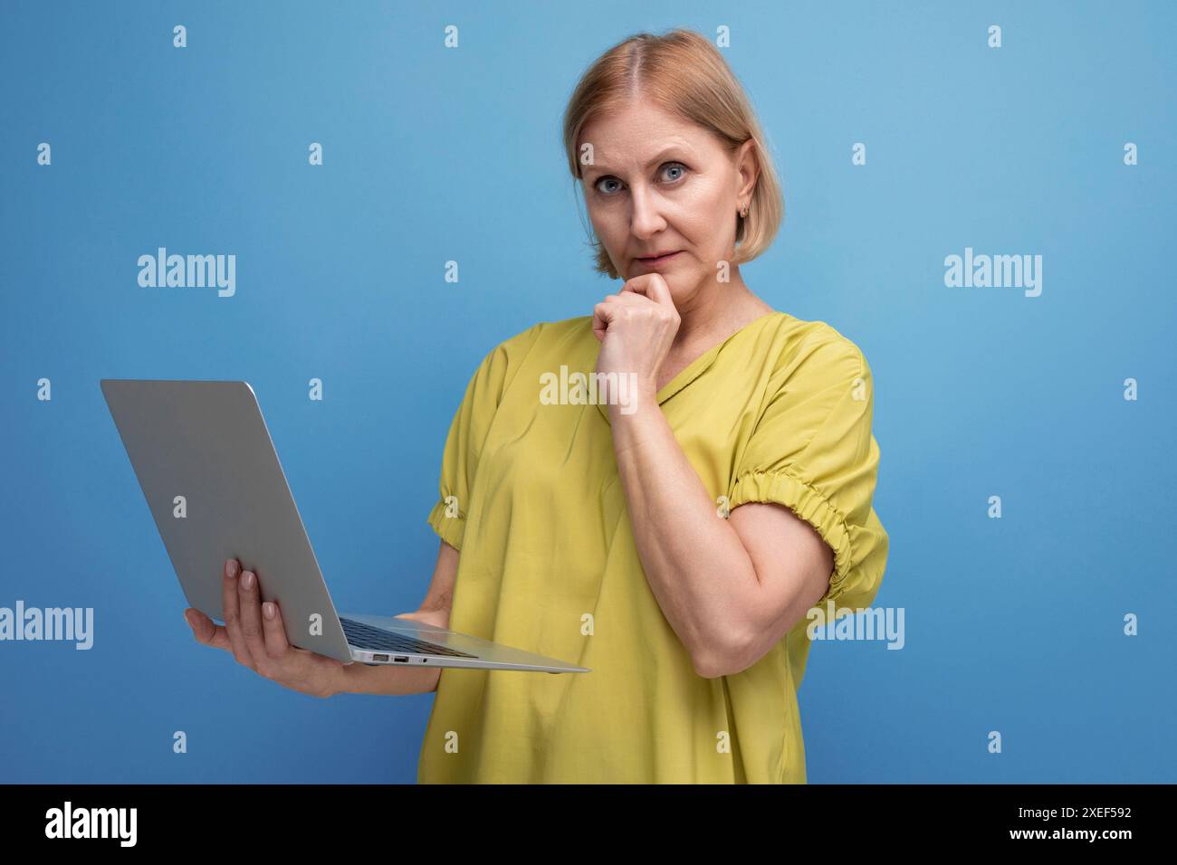 Portrait aged female consumer typing hi-res stock photography and ...