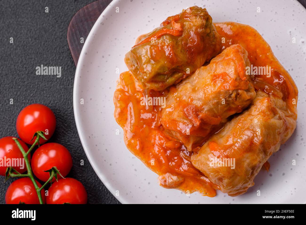 Delicious dolma in tomato sauce with carrots, onions, salt, spices and ...