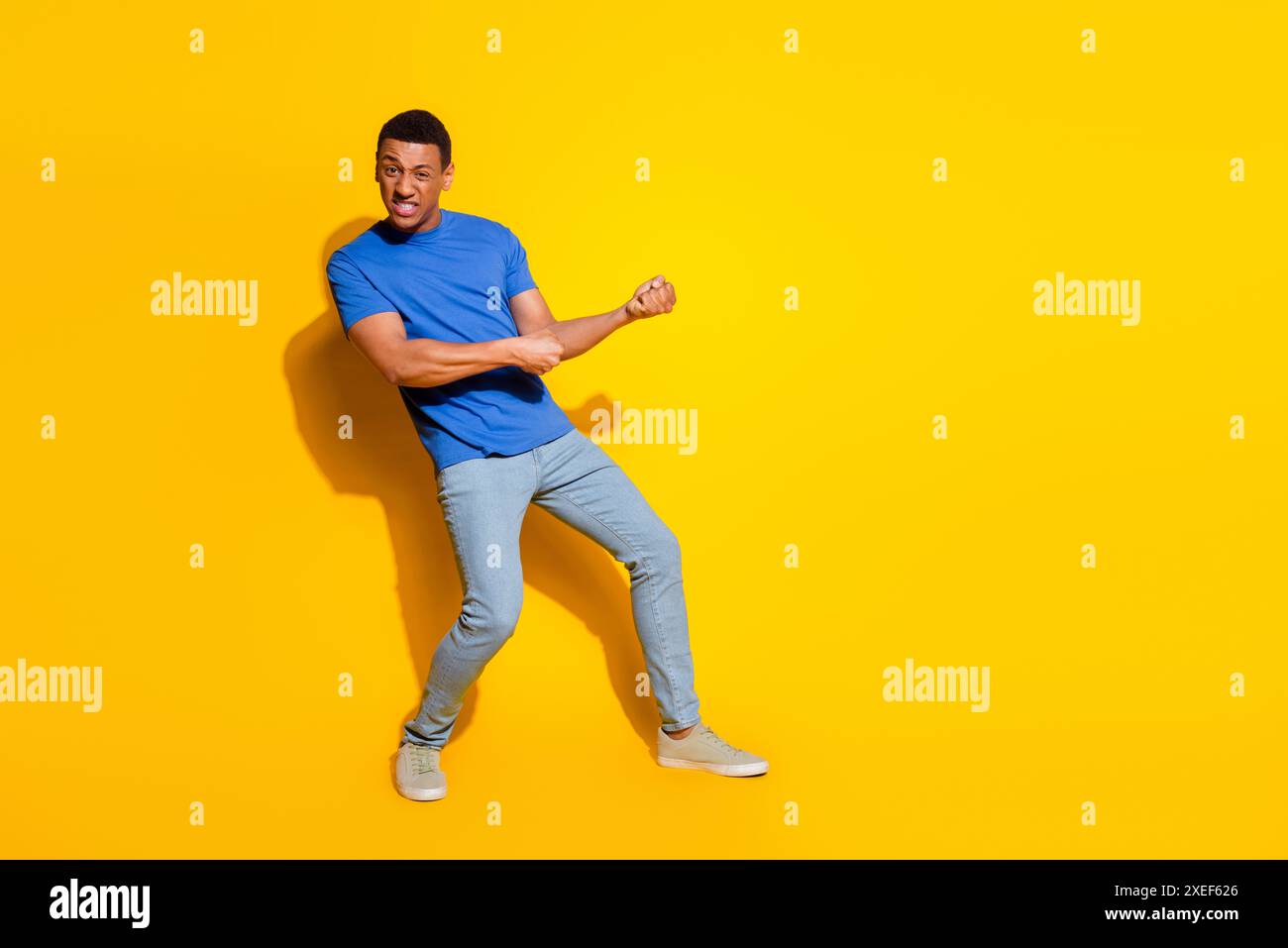 Full body photo of attractive young man pull empty space suffer dressed ...