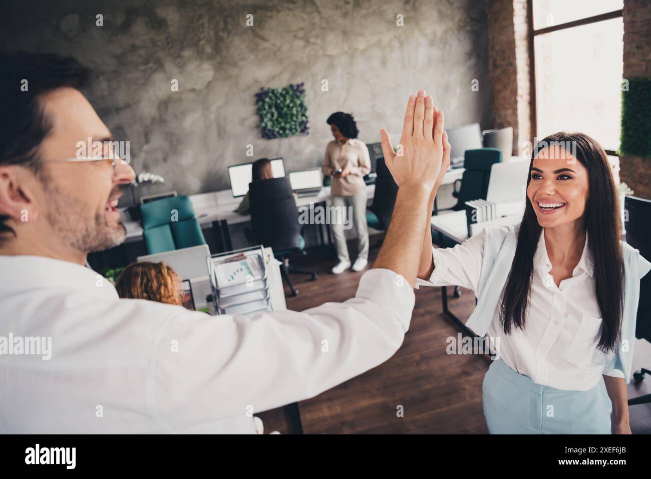 Photo of teamwork young people high five working together employees ...