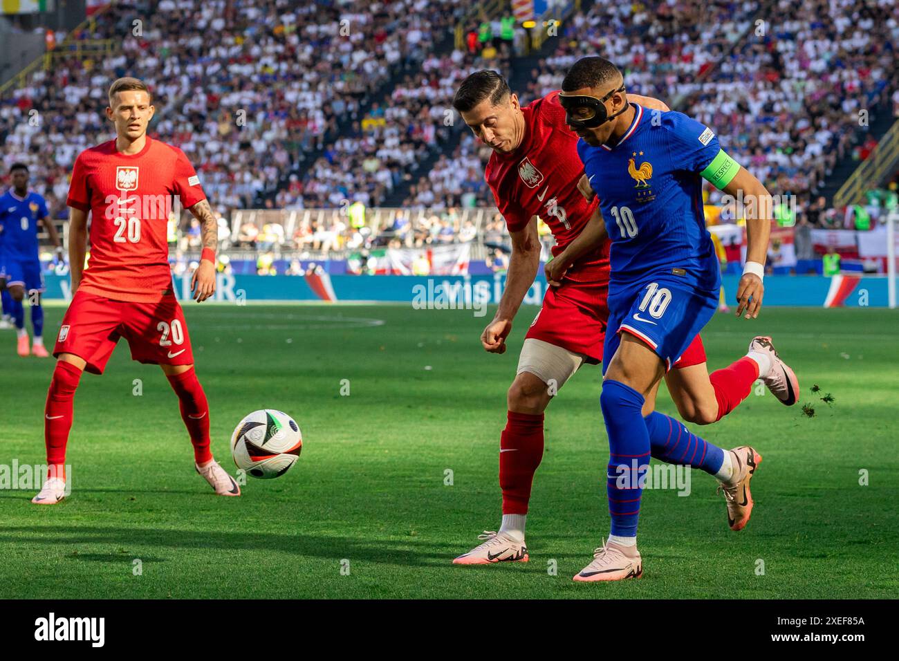 Robert Lewandowski (L) of Poland and Kylian Mbappe (R) of France are ...