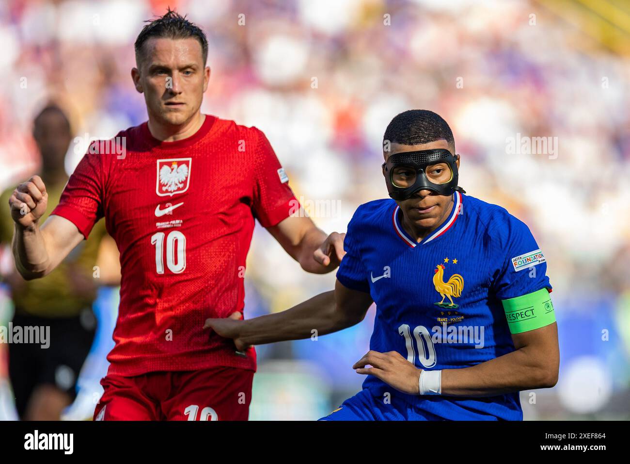 Piotr Zielinski (L) of Poland and Kylian Mbappe (R) of France are seen ...