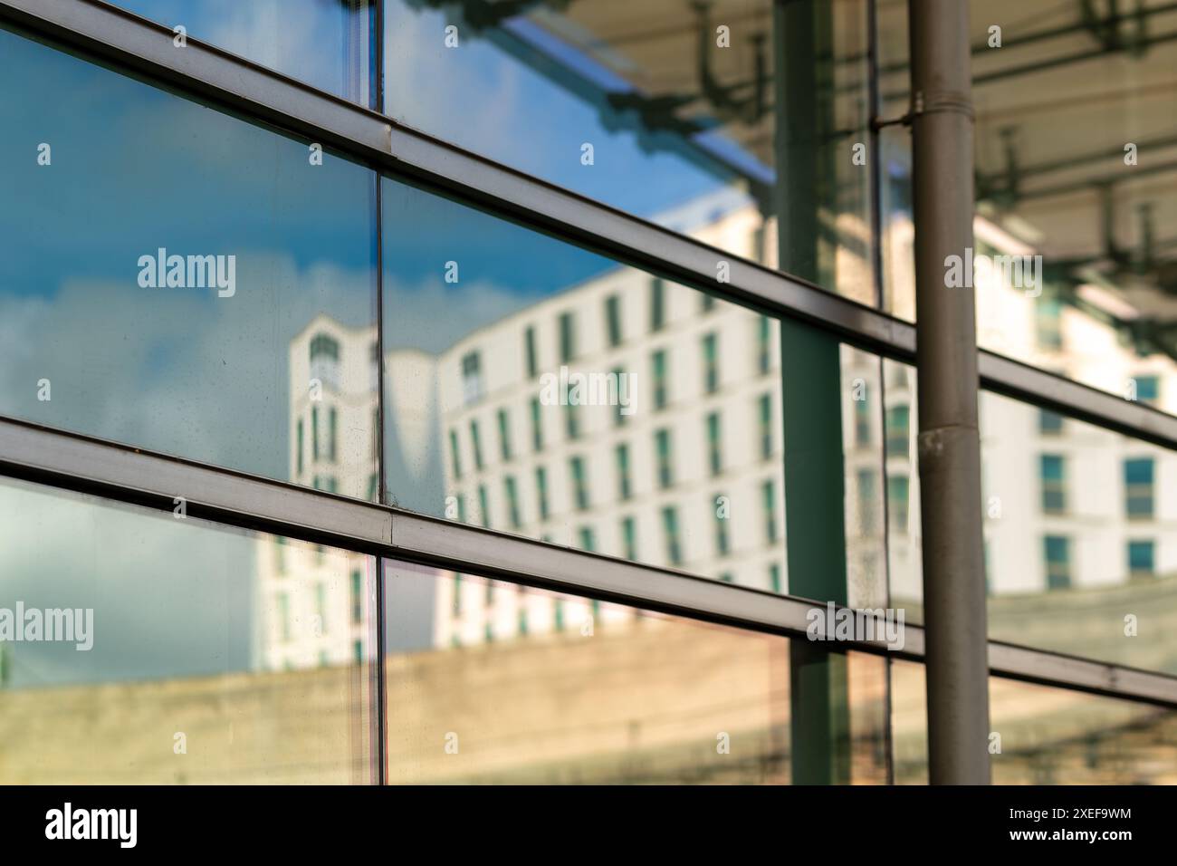 A house is reflected on a window of an exterior facade Stock Photo - Alamy