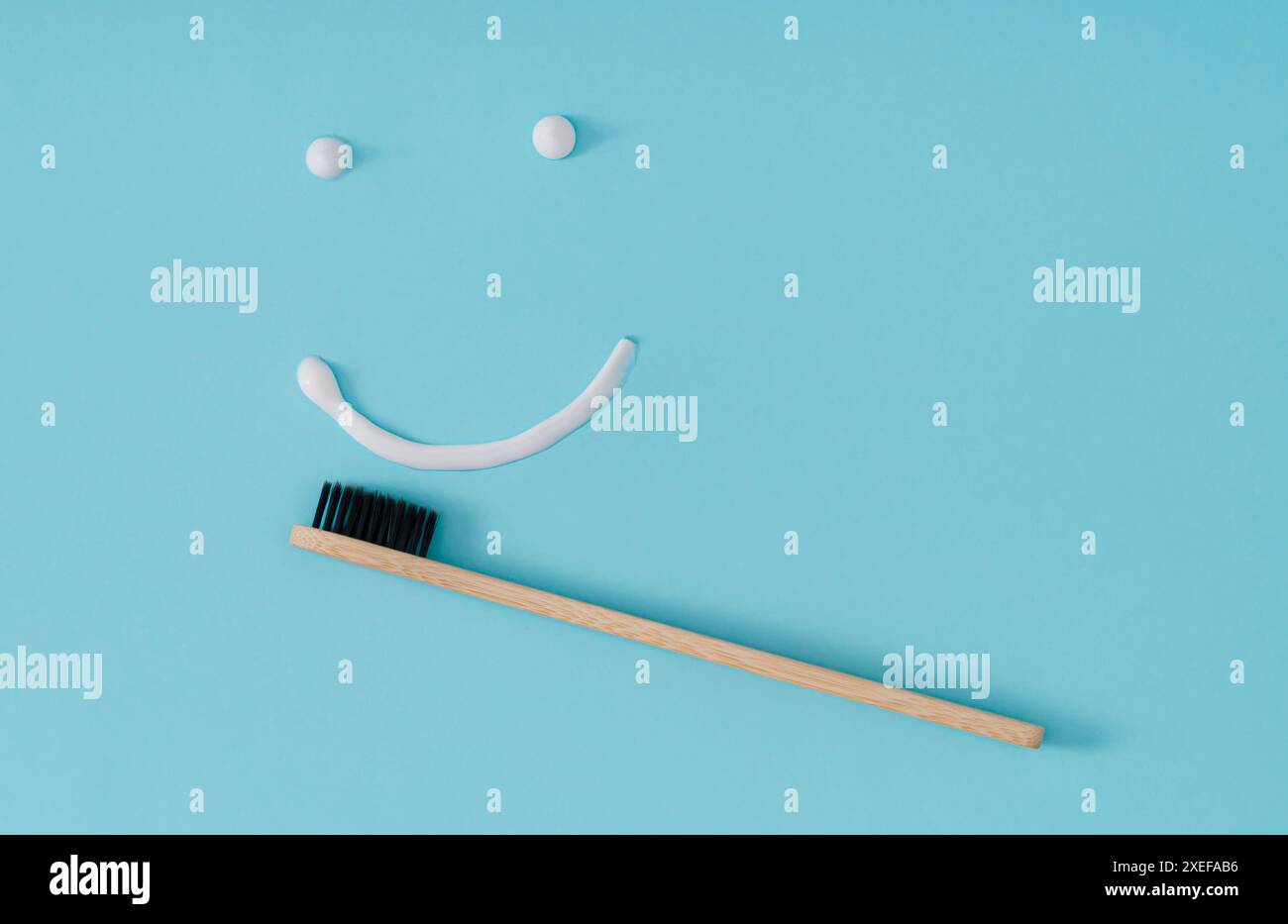 Organic bamboo toothbrush and white medical toothpaste making smile ...