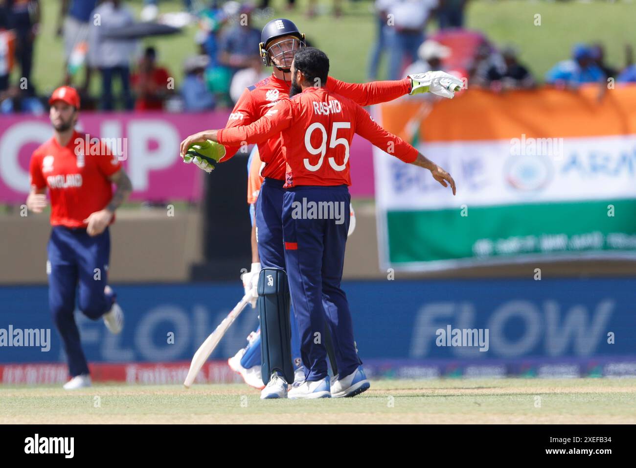 England's Adil Rashid celebrates after taking the wicket of India's ...