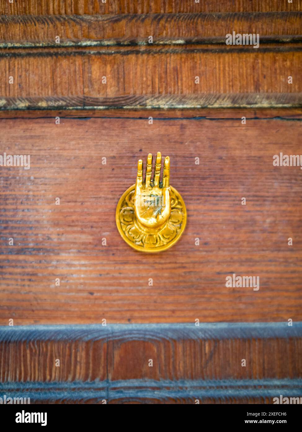Brass doorknob in Abhayamudra gesture design, symbolizing reassurance ...