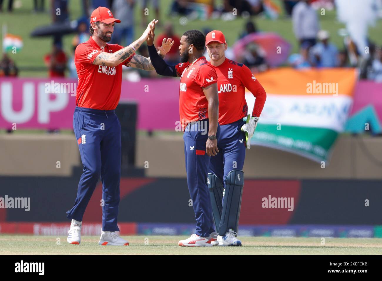 England's Chris Jordan celebrates after taking the wicket of India's ...