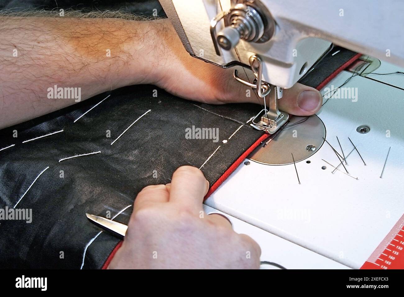 Sewing on the sewing machine Stock Photo - Alamy