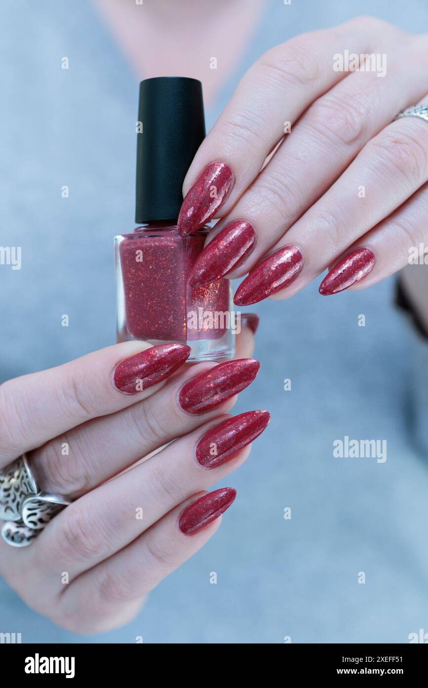 Woman hand holding rose red nails hi-res stock photography and images ...
