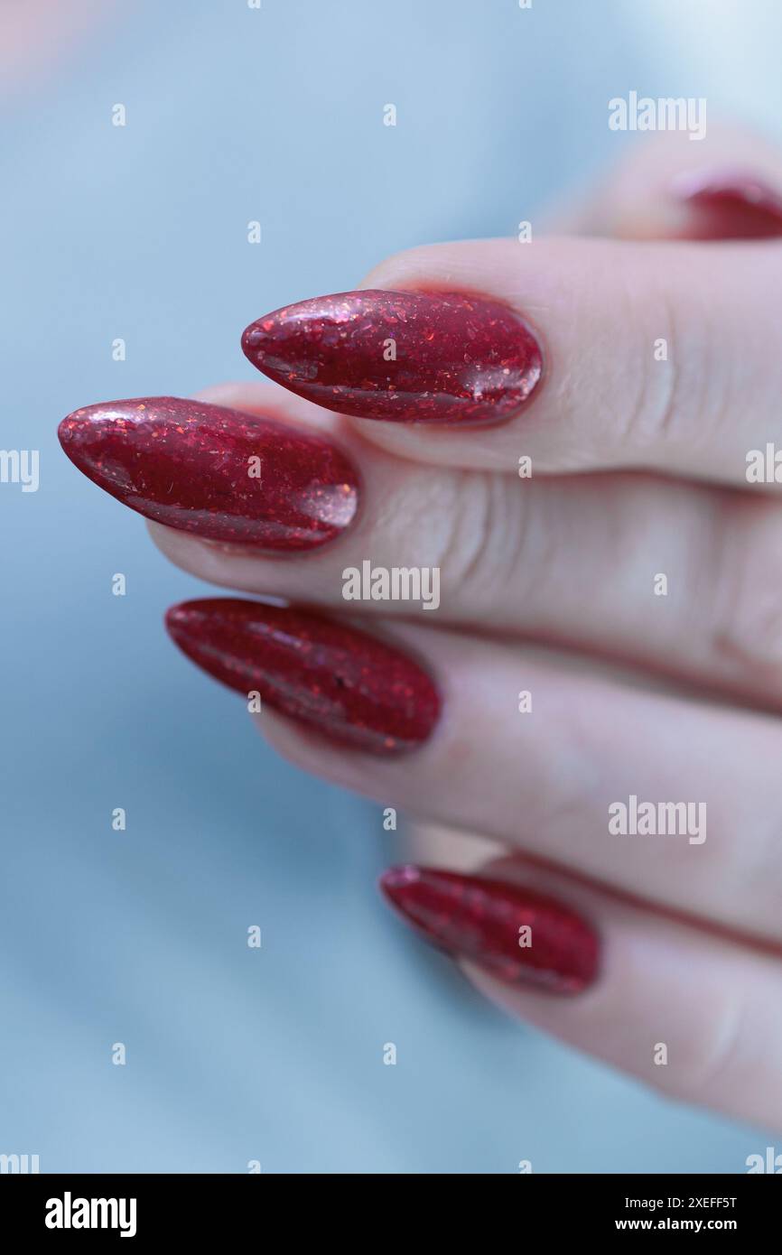 Woman hand holding rose red nails hi-res stock photography and images ...