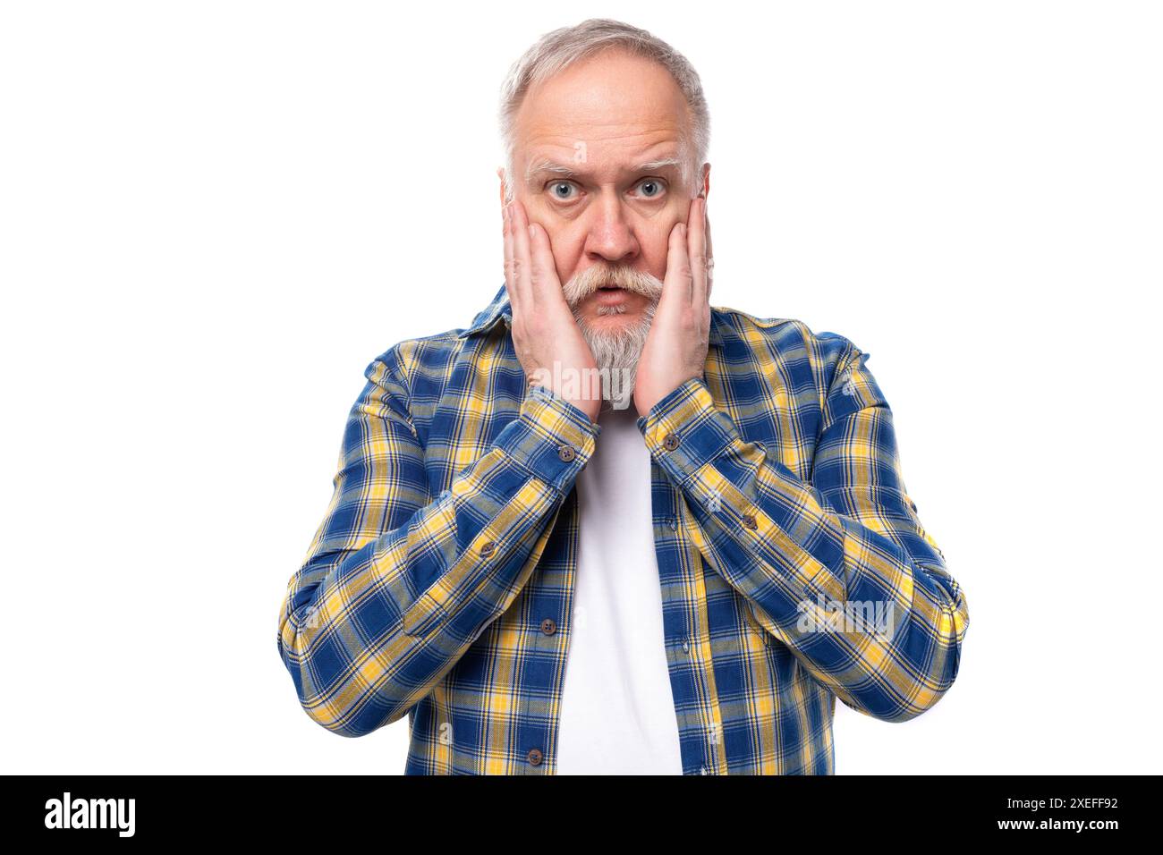 Handsome 50s elderly gray-haired man with a beard is going through ...