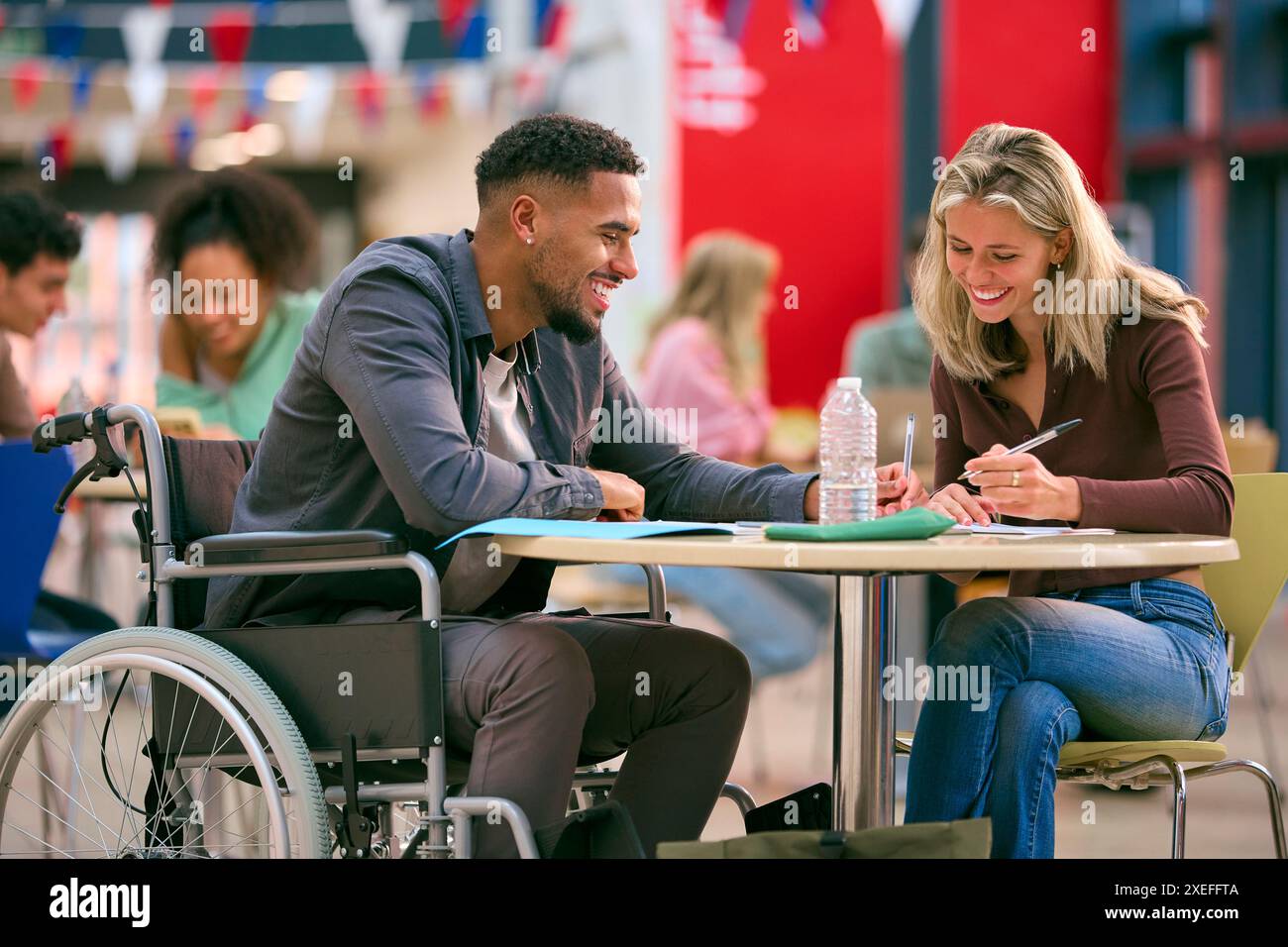 Two College Or University Students With One In Wheelchair Working ...