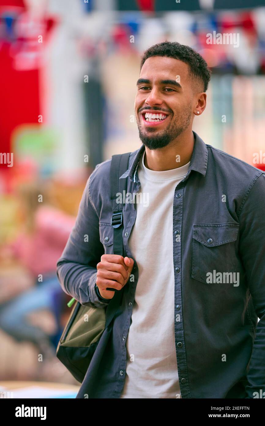 Portrait Of Smiling Male University Student With Backpack Standing ...