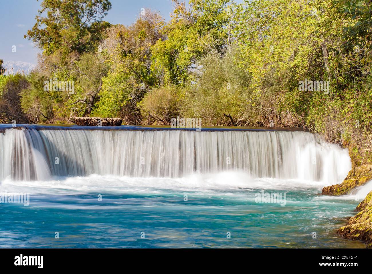 wide and low waterfall on river, blurred water movement Stock Photo - Alamy