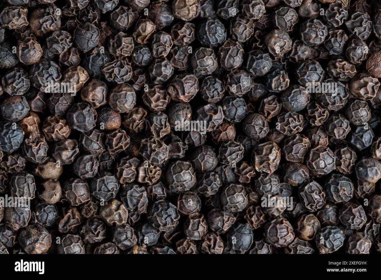 Black pepper background Stock Photo - Alamy