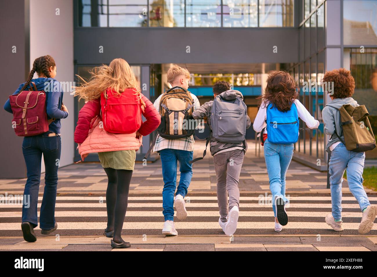 Group Of Secondary Or High School Pupils Running Away From Camera ...