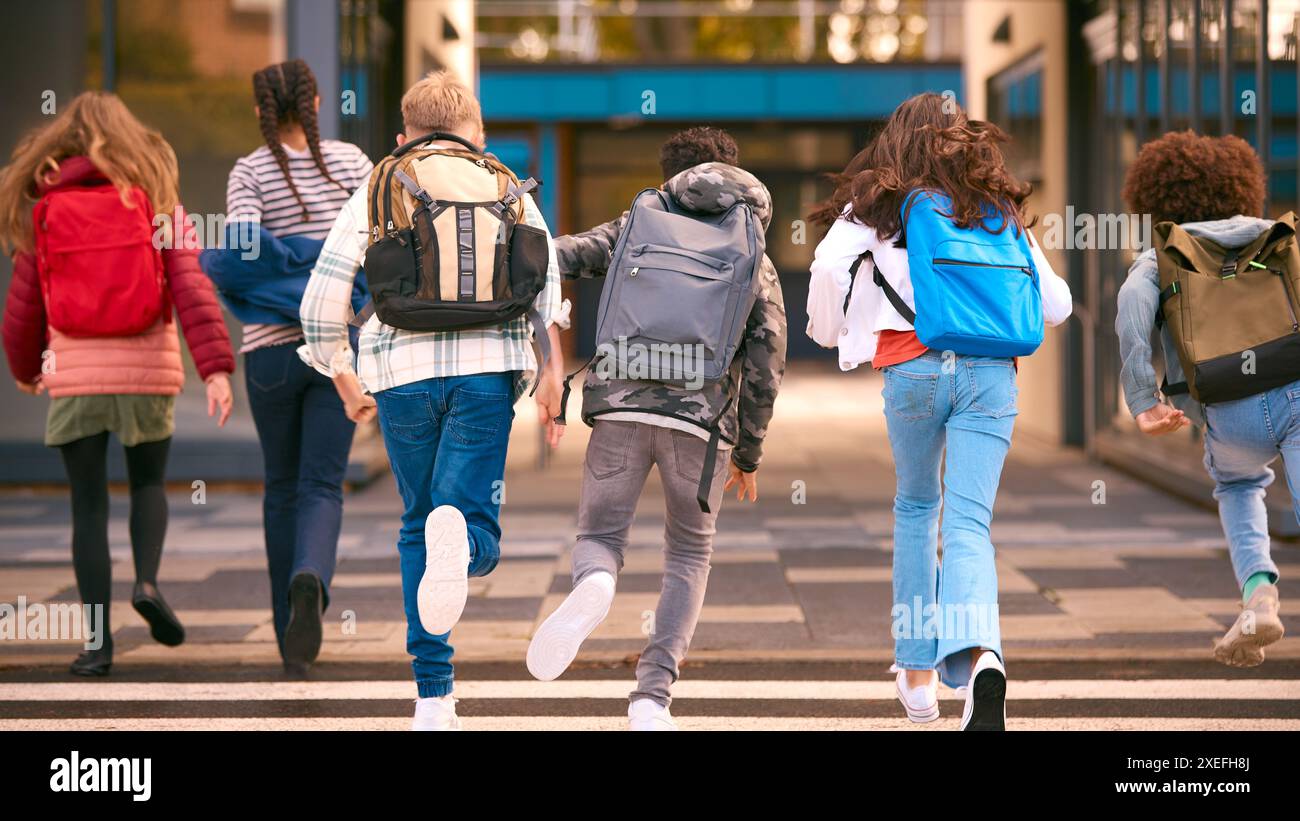 Group Of Secondary Or High School Pupils Running Away From Camera ...