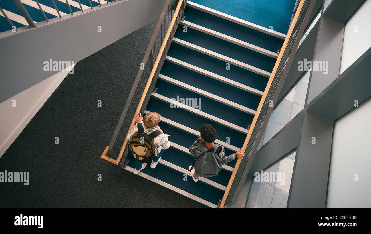 Two Male Secondary Or High School Pupils Inside School Building On ...
