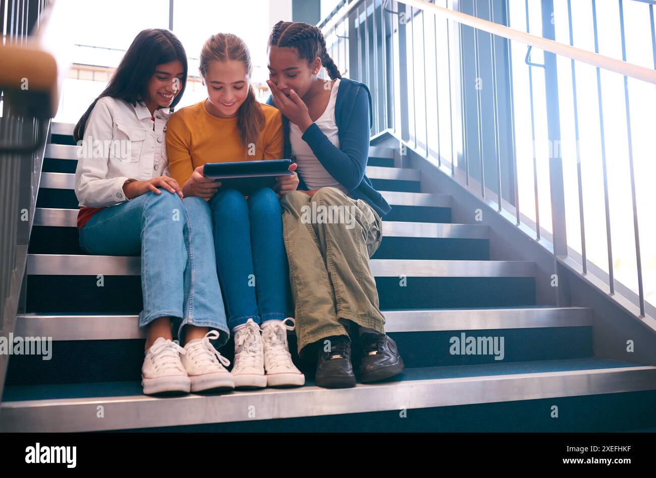 Three Female Secondary Or High School Pupils Inside School Building On ...