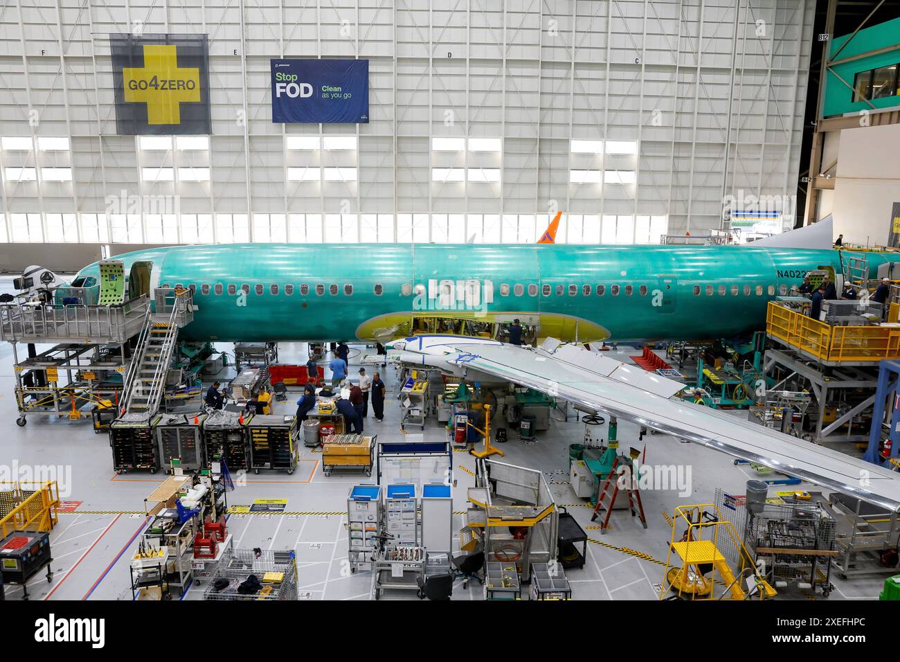 A Boeing 737 MAX aircraft is shown on the assembly line during a brief ...