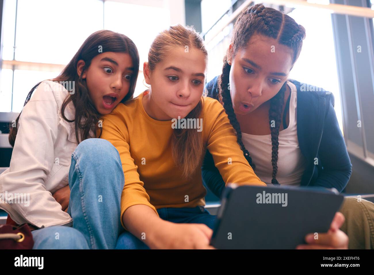Three Female Secondary Or High School Pupils Inside School Building On ...