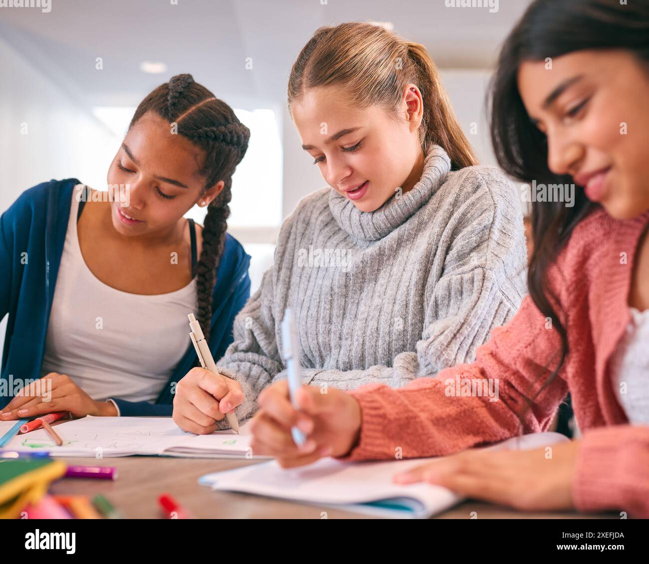 Three Female Secondary Or High School Students Collaborating In Study ...