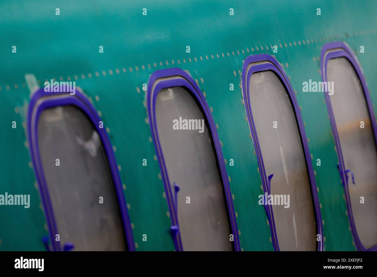 A Boeing 737 MAX aircraft is shown on the assembly line during a brief ...