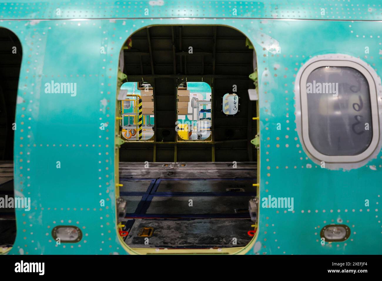 A Boeing 737 MAX aircraft is shown on the assembly line during a brief ...