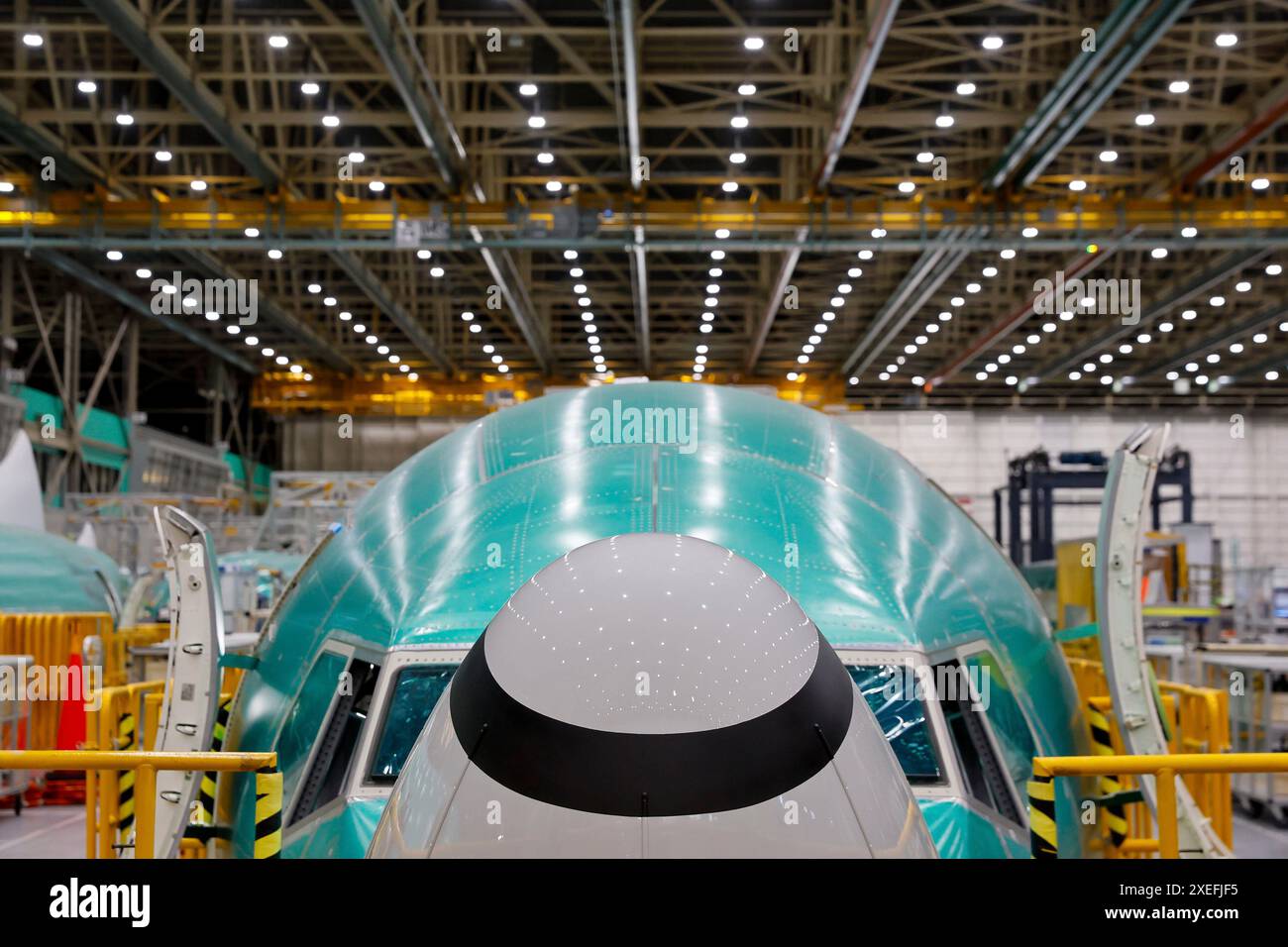 A Boeing 737 MAX aircraft is shown on the assembly line during a brief ...