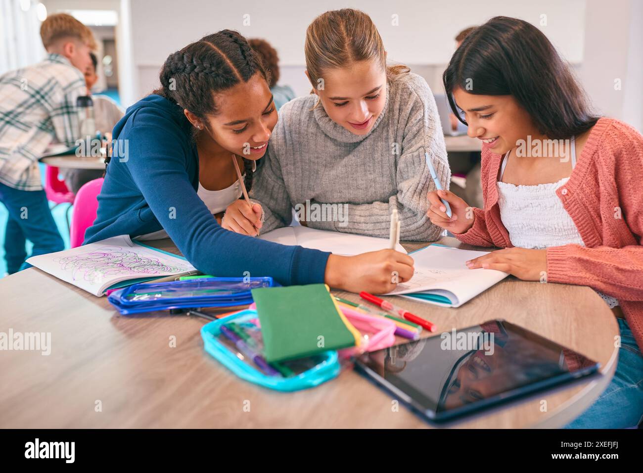 Three Female Secondary Or High School Students Collaborating In Study ...