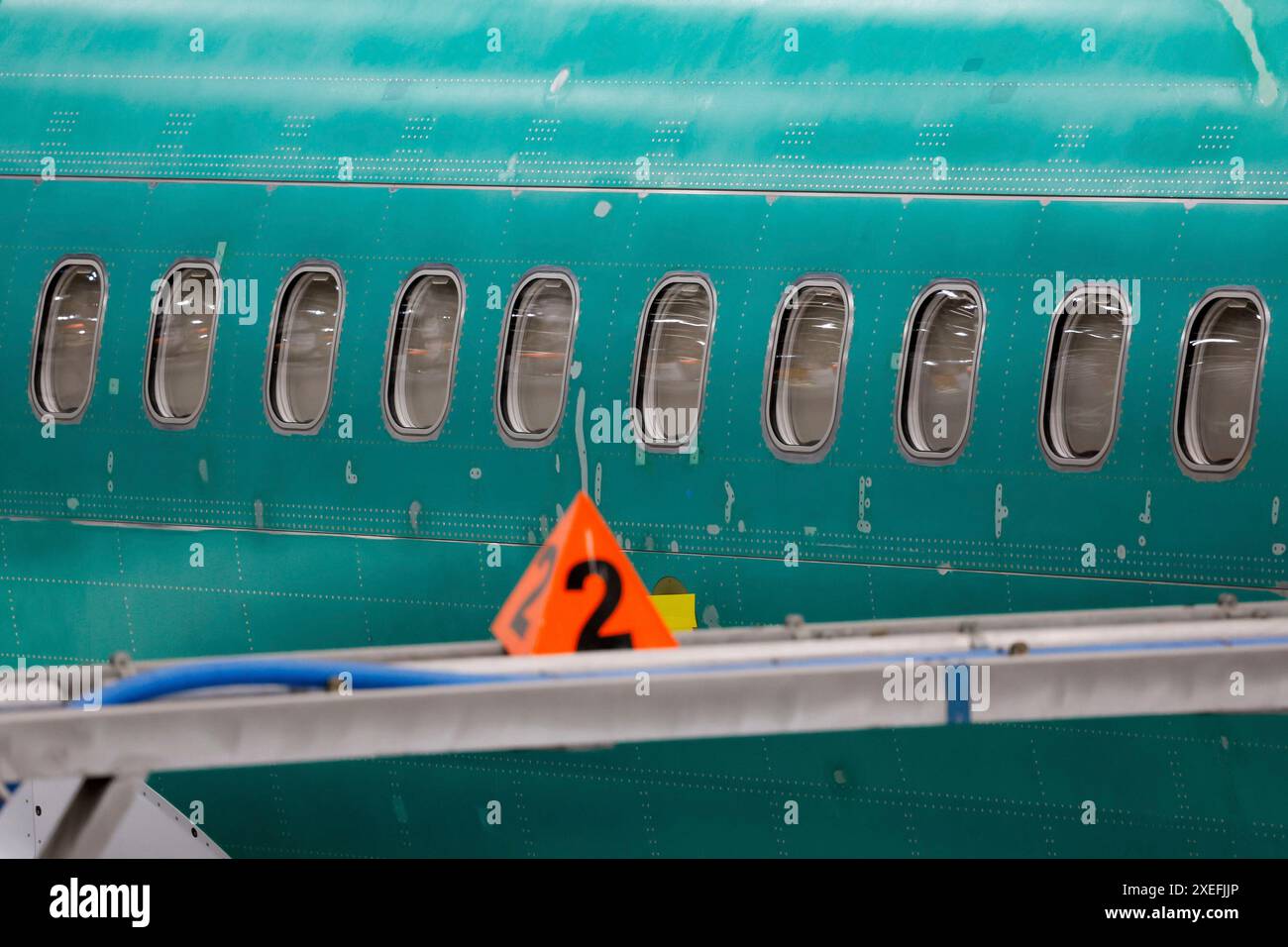 A Boeing 737 MAX aircraft is shown on the assembly line during a brief ...