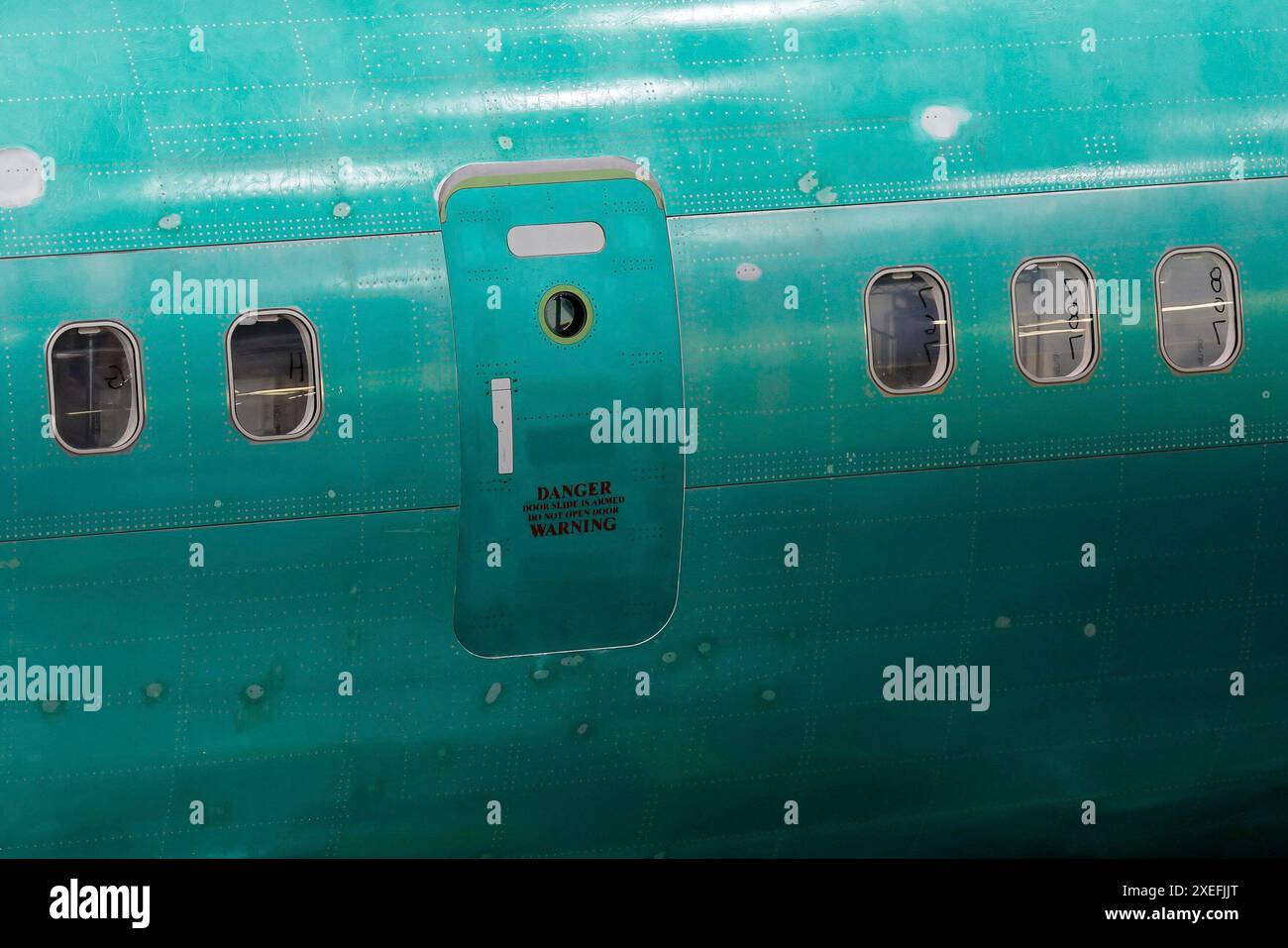 A Boeing 737 MAX aircraft is shown on the assembly line during a brief ...
