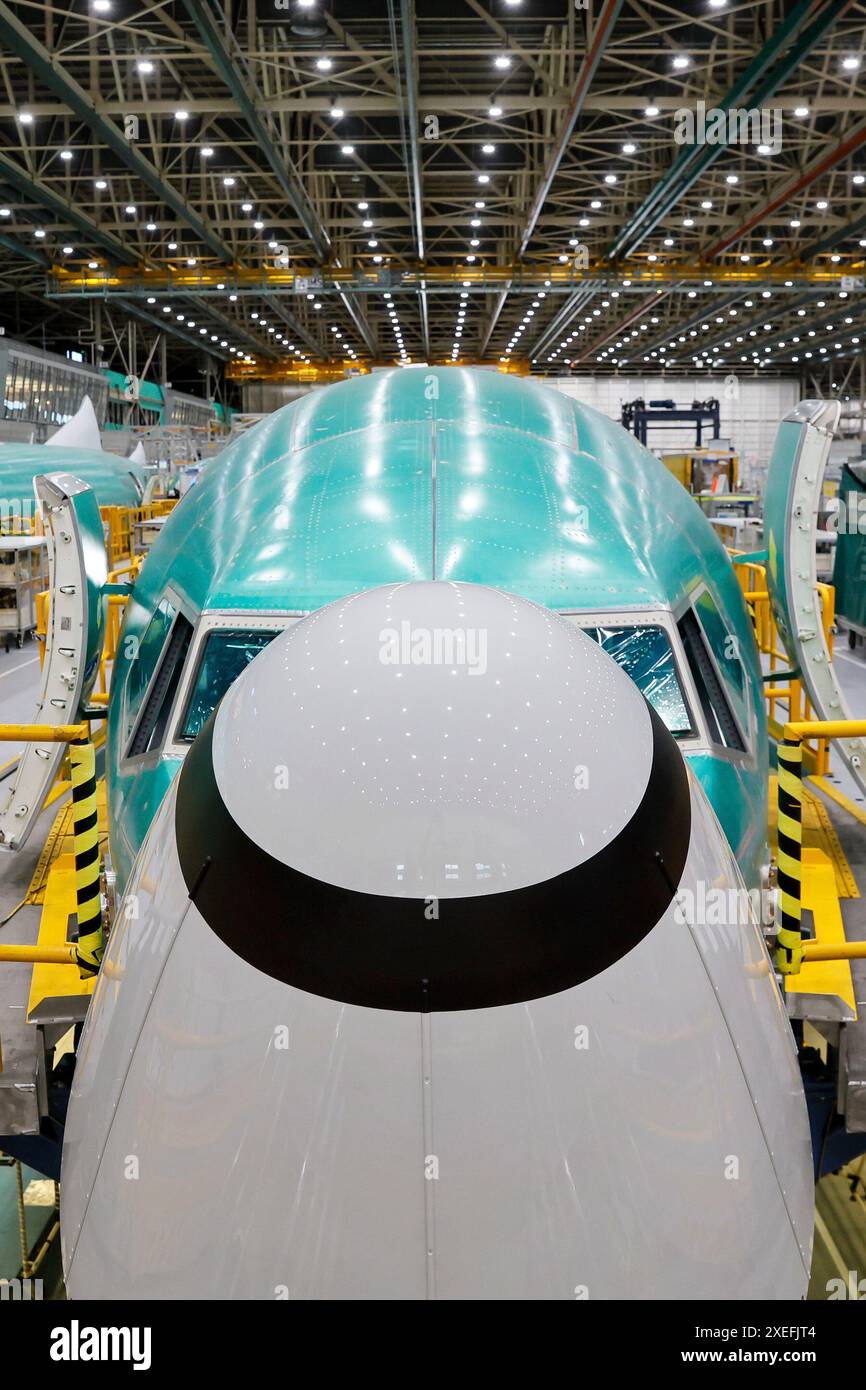 A Boeing 737 MAX aircraft is shown on the assembly line during a brief ...