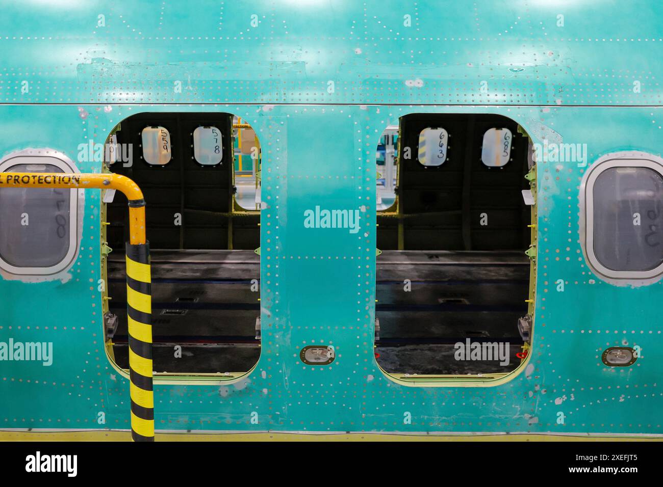 A Boeing 737 MAX aircraft is shown on the assembly line during a brief ...