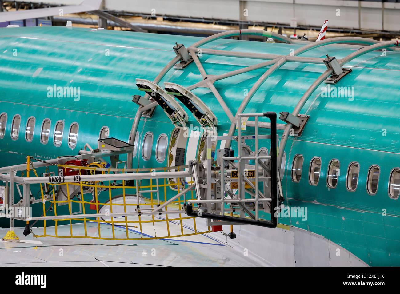 A Boeing 737 MAX aircraft is shown on the assembly line during a brief ...