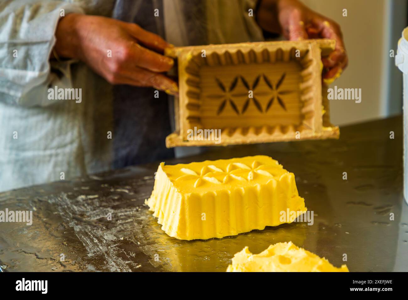 Butter production in the cheese dairy belonging to the Filzmoosalm ...