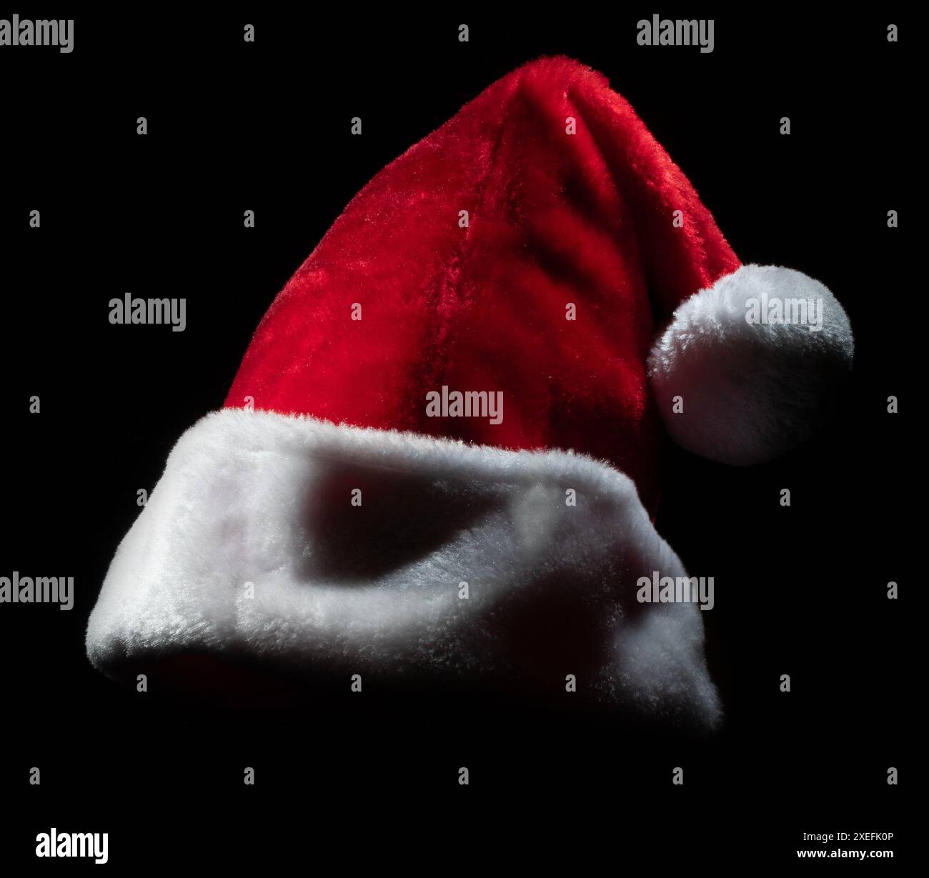 Hard directional light hitting a Santa Claus hat in red and white from ...