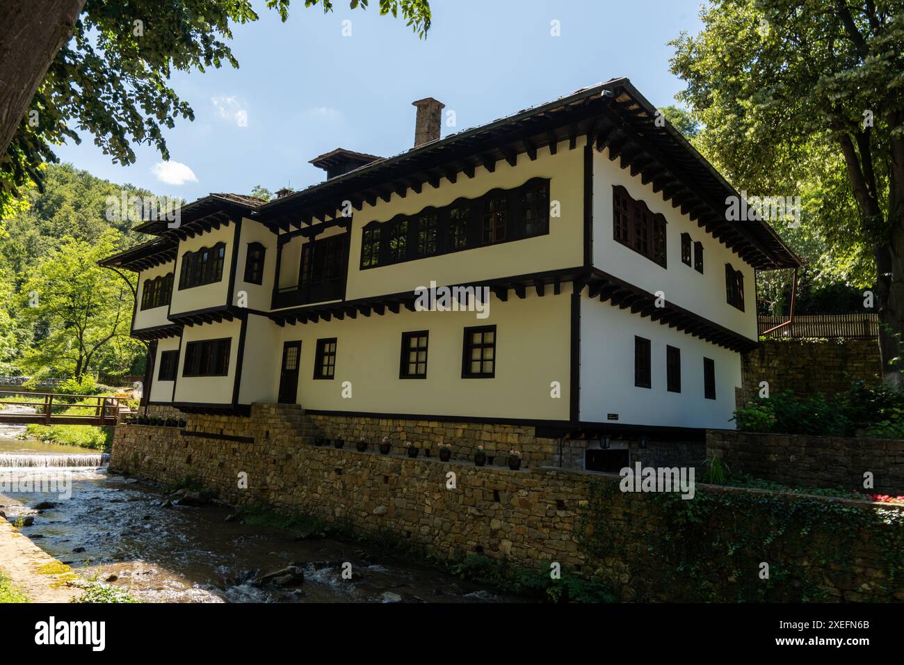 Traditional bulgarian house with white walls and dark wooden beams ...