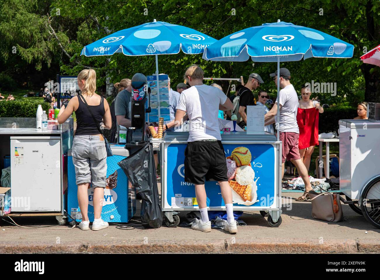 Ice cream vendors at work at Kumpula Village Party in Kumpula district ...