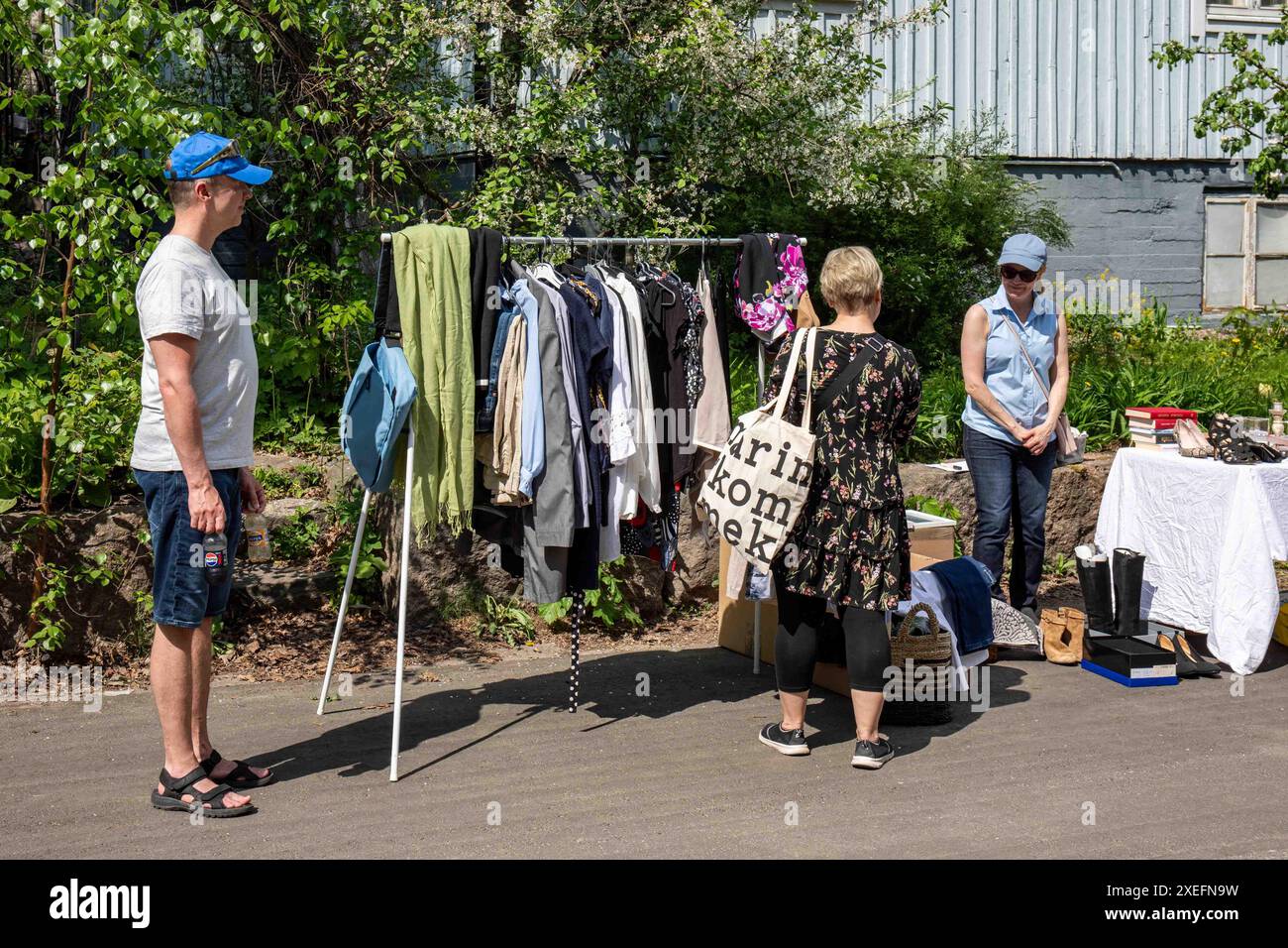 People at browsing used goods at Kumpula Village Party street fair pop ...