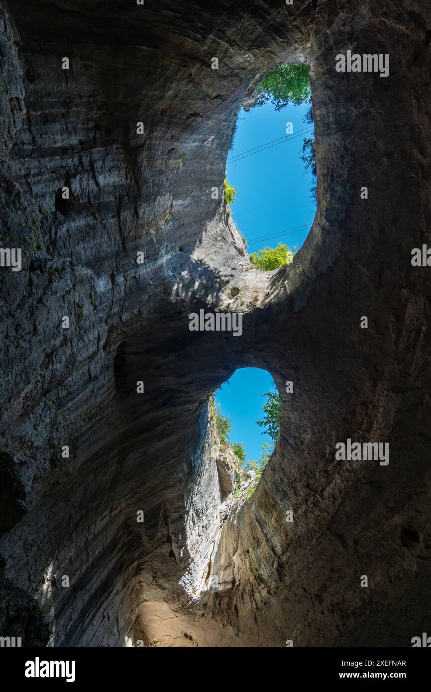 Sunlight entering through holes in the ceiling of prohodna cave, known ...
