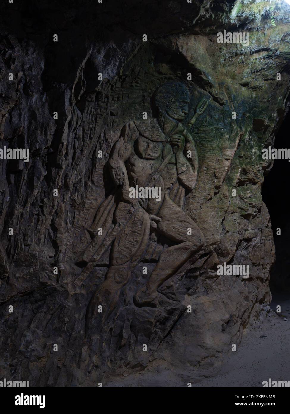Ancient stone carving of a roman soldier holding a spear, carved into ...